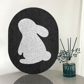 White Rabbit Scratching Pad On Black Background